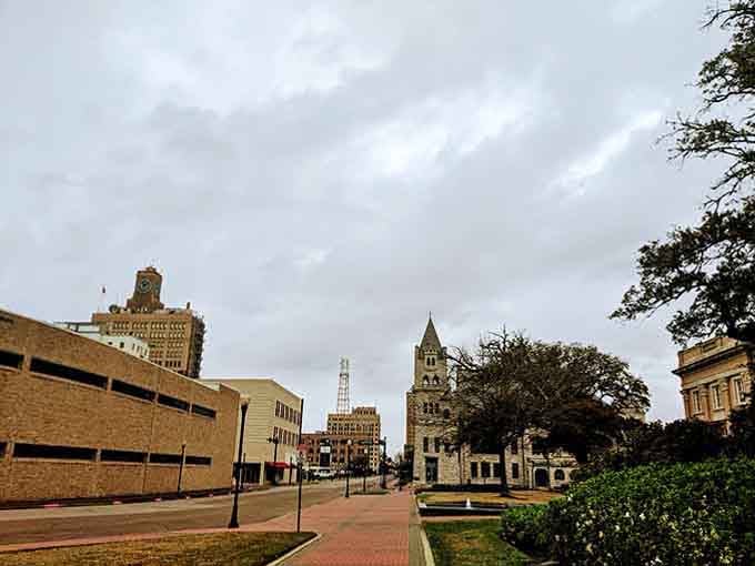 Historic towers stand proud against cloudy skies, anchoring a community where neighbors still wave and life moves pleasantly slow.