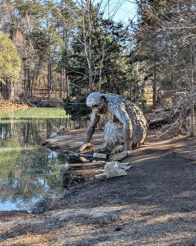 This gentle giant pauses by the water's edge, reminding us that art and nature make the most magical neighbors.