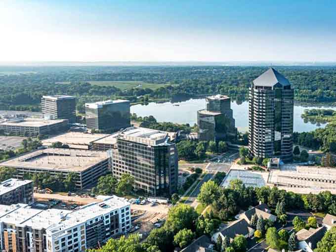 Lakes and modern buildings coexist peacefully, proving you can have your urban cake and eat it by the water too.