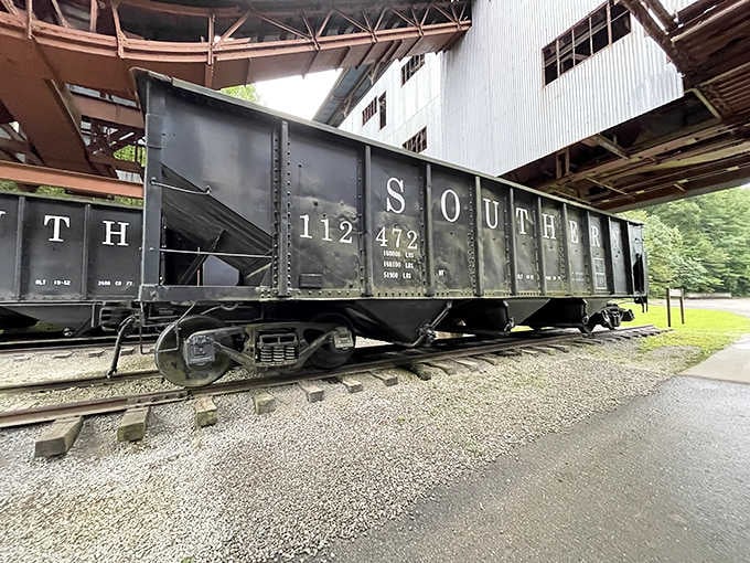 The weathered Southern Railway freight car rests quietly, its faded lettering whispering tales of cargo hauled across distant states.