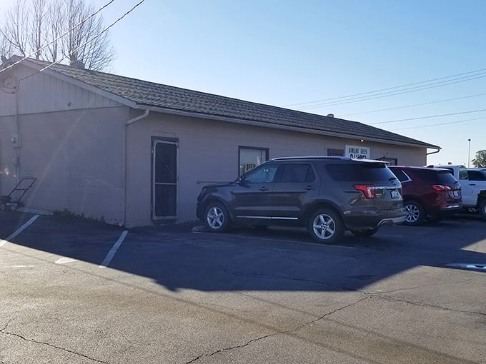 That modest exterior hides a treasure trove of home cooking where the only thing fancier than the sign is the flavor.