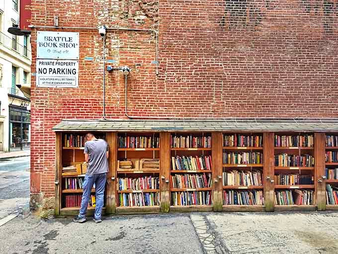 Books built into the brick wall create an outdoor library where browsing feels like discovering hidden treasure daily.