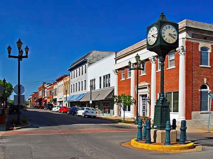 That town clock keeps perfect time over storefronts where business still happens with handshakes and hometown pride.
