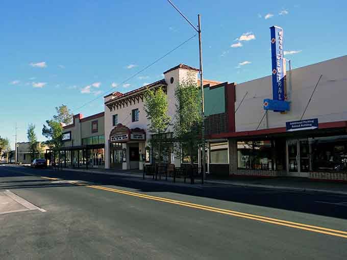 Classic downtown storefronts sit beneath clear Arizona skies, showing off small-town character with plenty of sunshine.