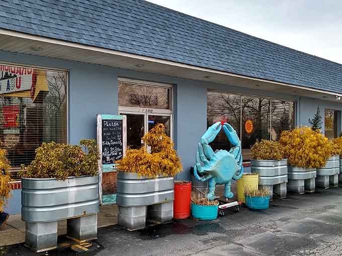 The bright blue crustacean standing guard outside tells you everything—this place celebrates Chesapeake Bay's finest bounty.
