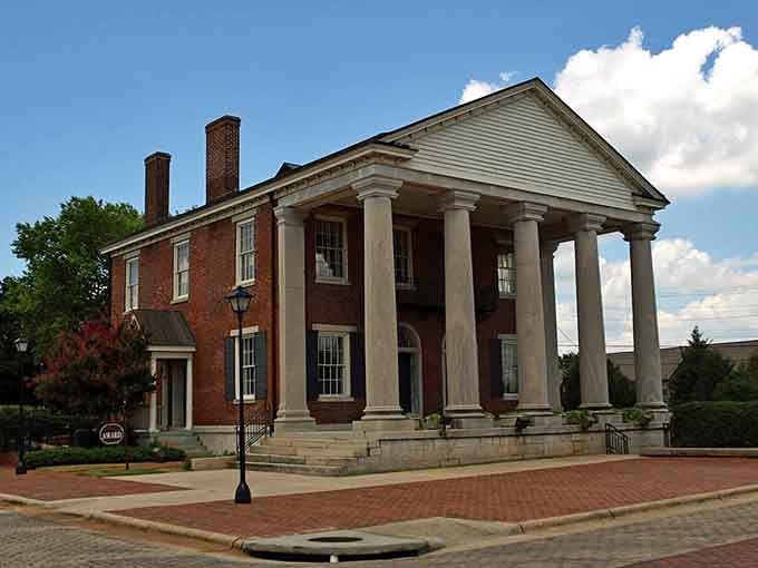 Those grand columns stand proud like they're auditioning for Gone with the Wind but with better parking.