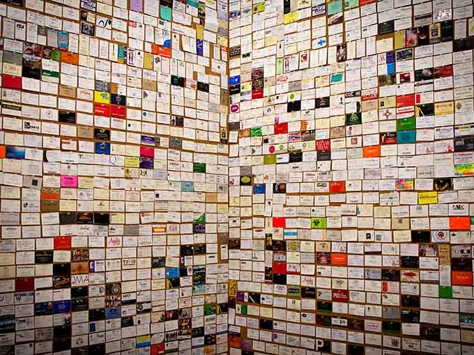 Thousands of cards create a wall of connection, each one a tiny window into someone's professional world.