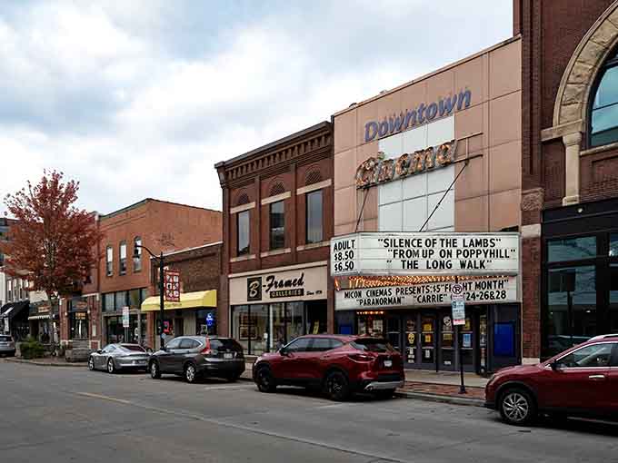 The downtown theater marquee promises entertainment while historic storefronts invite exploration on tree-lined streets below.