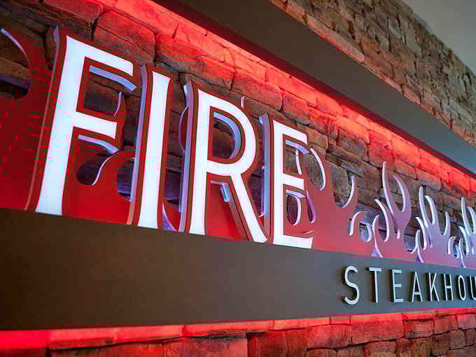 That close-up of the Fire signage glows like a campfire, promising warmth and incredible flavors within.