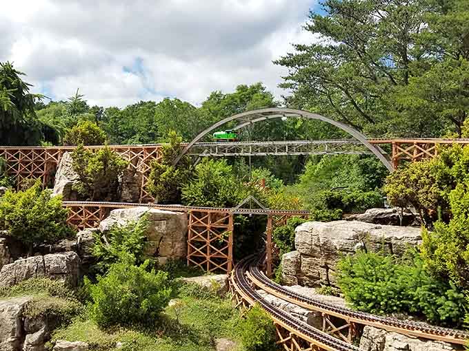 Model locomotives chug along elevated tracks through a landscape that proves good things really do come in small packages.