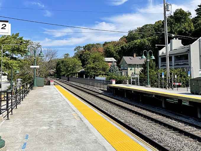 The yellow safety stripe guides commuters home while the surrounding hills promise weekend adventures just minutes away.
