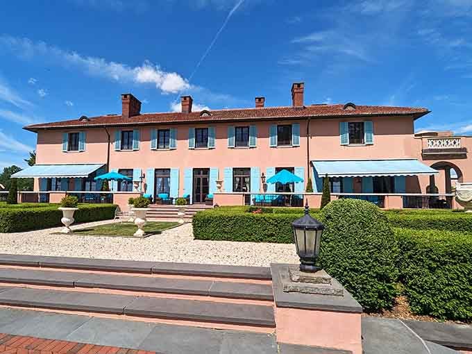 The Italian villa architecture surrounded by pristine lawns creates an escape so complete, you'll forget what century you're dining in.