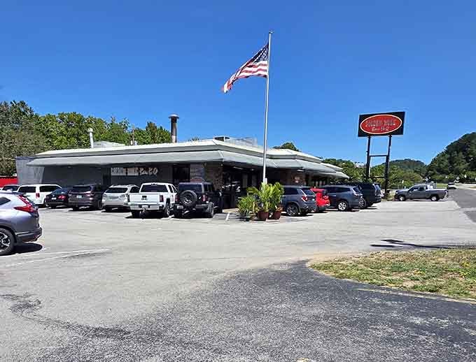 That packed parking lot and American flag flying high tell you locals know exactly where the best barbecue lives.