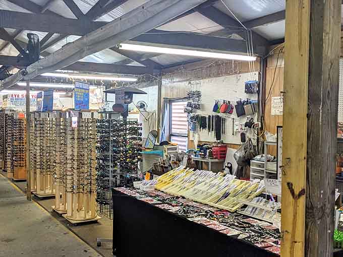 Sunglasses spin on rotating displays while accessories dangle overhead like a fashionista's fever dream come true.