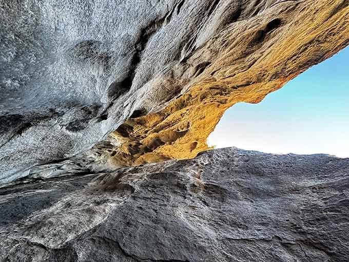 Layers of stone create a natural arch, painted in earth tones that shift beautifully with the changing light.