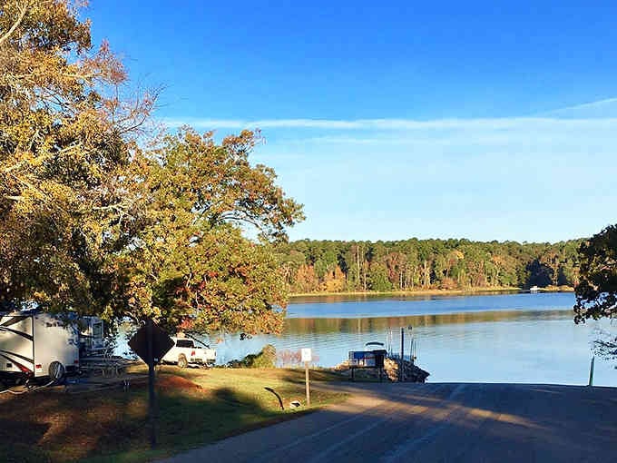 Lakeside camping offers front-row seats to nature's daily show, with autumn colors reflecting perfectly in the calm blue water.