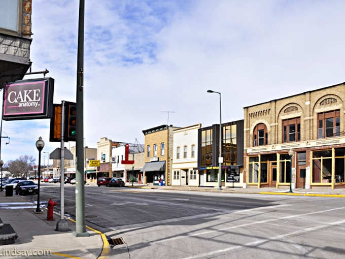 Corner storefronts showcase that classic small-town architecture where businesses have thrived for generations without corporate logos.