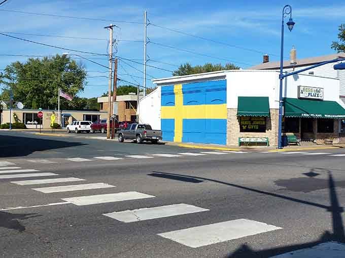 That Swedish flag mural announces the town's heritage louder than any welcome sign ever could manage.