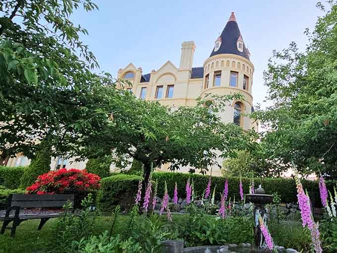 Flowering gardens frame this hilltop castle where history and hospitality meet in spectacular fashion.