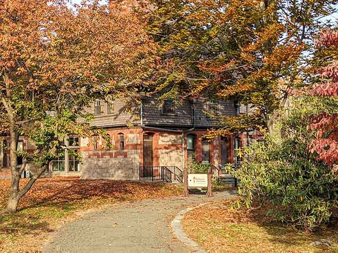 Autumn leaves frame the ornate architecture like nature decided to match the house's creative spirit with her own palette.