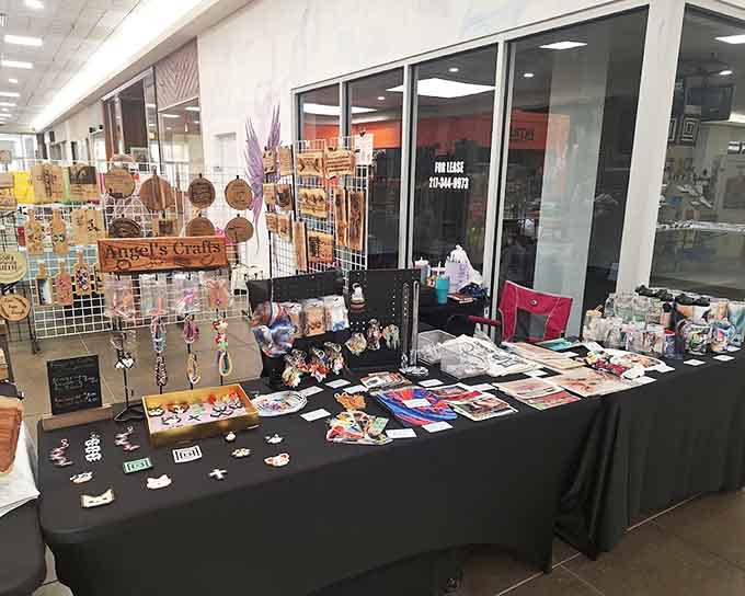 Local artisans display their handcrafted treasures under white tents where creativity meets community on small-town streets every week.