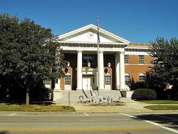 Classical columns frame the courthouse entrance with stately grace, embodying small-town civic pride at its finest.