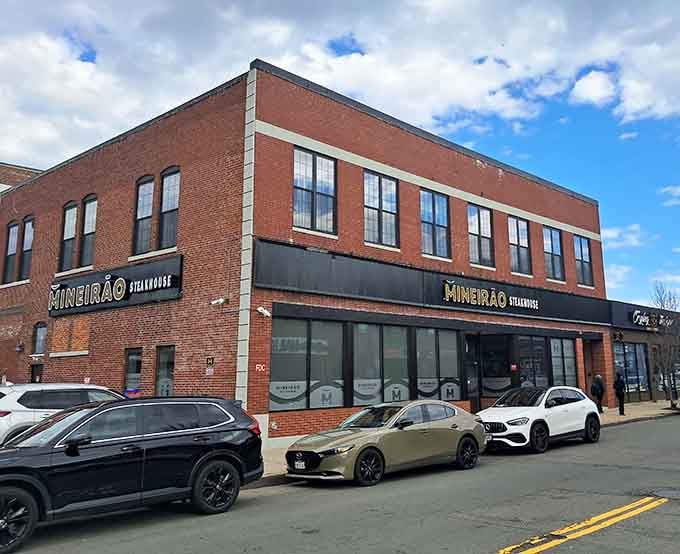 The brick building's second-story windows overlook a street where authentic churrasco meets New England hospitality every single night.