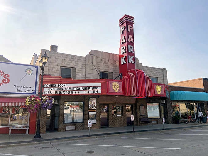 That bold Park Theater sign pops like a vintage postcard, inviting you to catch a show in true small-town style.