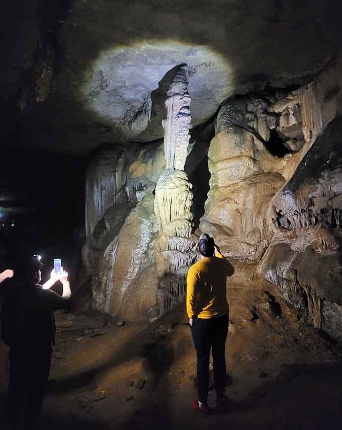 This towering stalagmite reaches toward the cave ceiling like Earth's slowest-growing sculpture, one drip at a time.