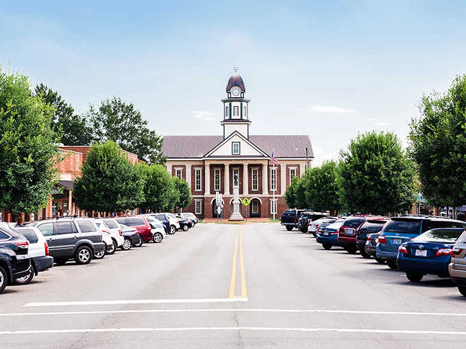 That courthouse anchors the street view like the town's proud centerpiece, framed perfectly by parked cars.