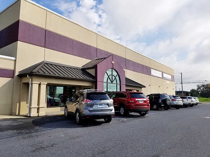 The purple accent panels add unexpected flair to a building dedicated to helping shoppers stretch every dollar further.