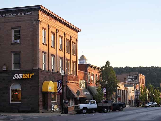 Golden hour bathes brick buildings in warm light, transforming an ordinary street into something worthy of a postcard.