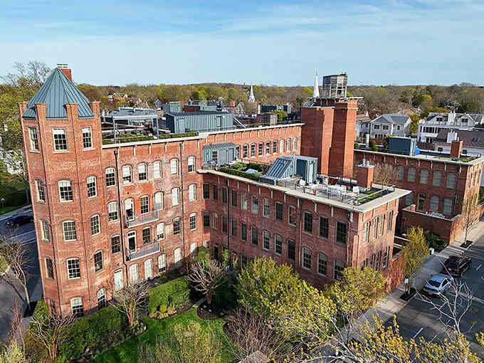 Old factory buildings stand converted and proud, their brick walls now housing the kind of businesses their builders never imagined.