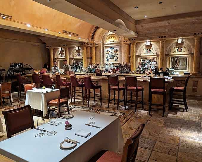 The warm interior glows with old-world charm where arched details and a well-stocked bar promise memorable evenings ahead.