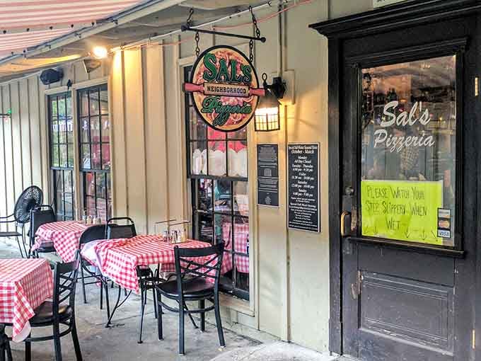 The charming outdoor seating area invites you to savor authentic New York-style pizza in island sunshine.