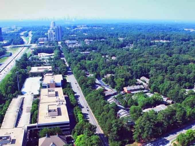 Green forests embrace Sandy Springs' suburban landscape, offering that rare combination of city convenience and natural tranquility together.