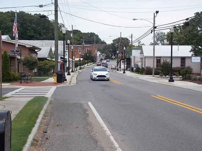 The main drag rolls gently through town, inviting leisurely strolls past shops that remember when customer service actually meant something.