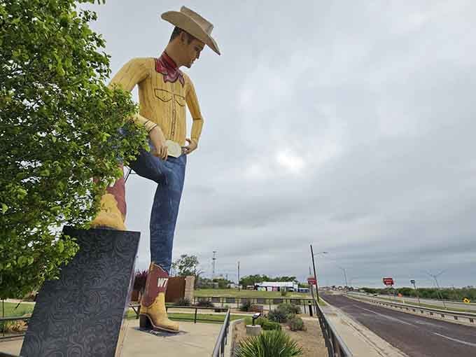 This 47-foot cowboy watches over the highway, his weathered paint telling stories of decades greeting passing travelers.