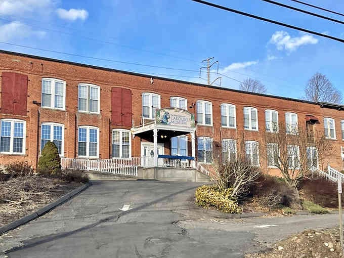 Behind these industrial windows, hand-carved horses await their chance to gallop through visitors' imaginations once more.