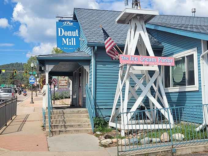 That decorative windmill and American flag combo gives off serious small-town charm that warms your heart before the coffee does.