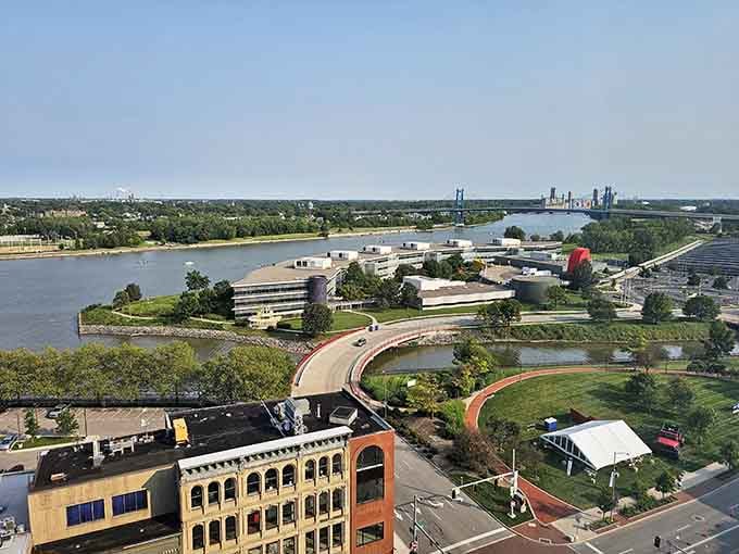The river curves through like nature's own highway, reminding us that the best city planning works with the landscape.