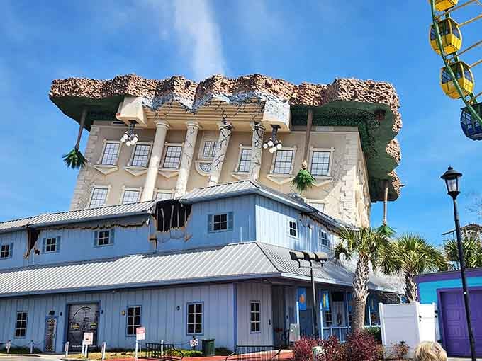 Palm trees stand guard beneath this topsy-turvy marvel, where the foundation became the roof in spectacular fashion.