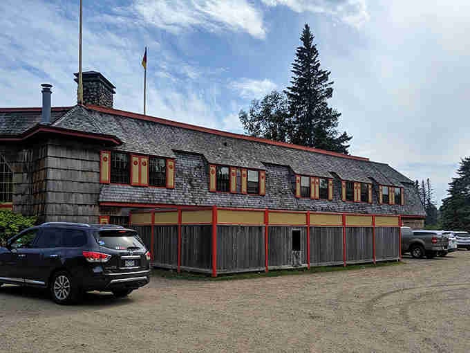 Classic north woods architecture with red trim and weathered shingles houses that famous kaleidoscope ceiling inside the dining room.