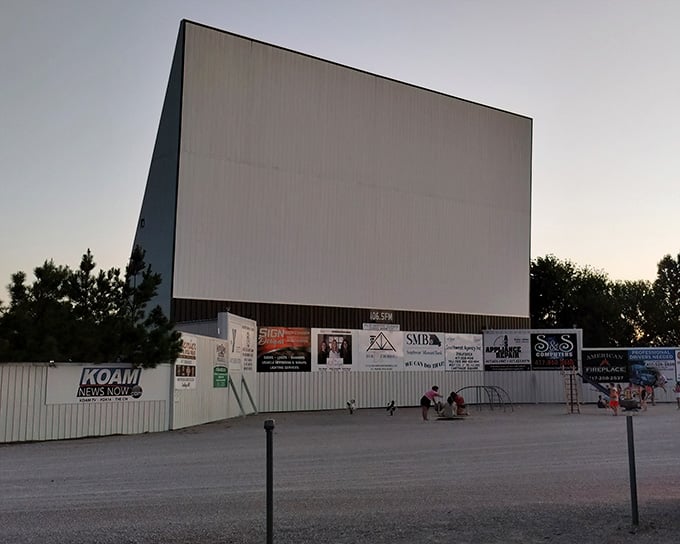 As twilight descends, the blank screen awaits its nightly transformation into a portal of cinematic wonder and community gathering.