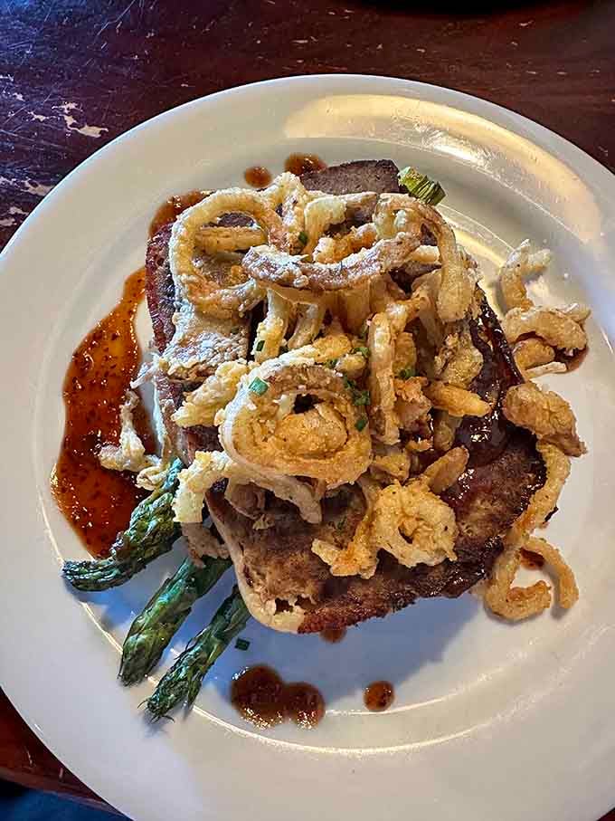 The steakhouse meatloaf arrives like comfort food royalty, proving ground beef deserves respect too when done properly.