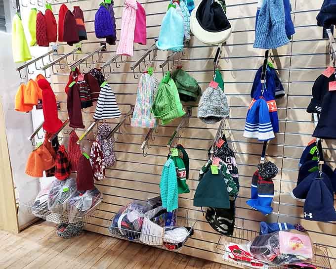 A rainbow of hats and bags hangs ready to complete your outfit or start your quirky collection.