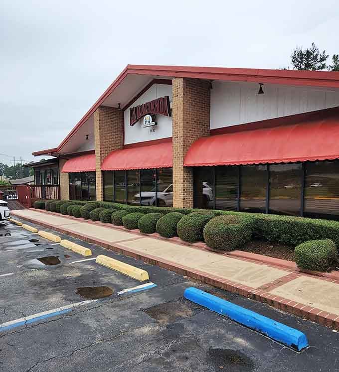 Those cheerful red awnings welcome diners like a warm hug, promising comfort food that actually comforts your soul.