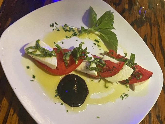 Simple ingredients elevated to art: tomatoes, mozzarella, basil, and the kind of olive oil that changes your perspective entirely.