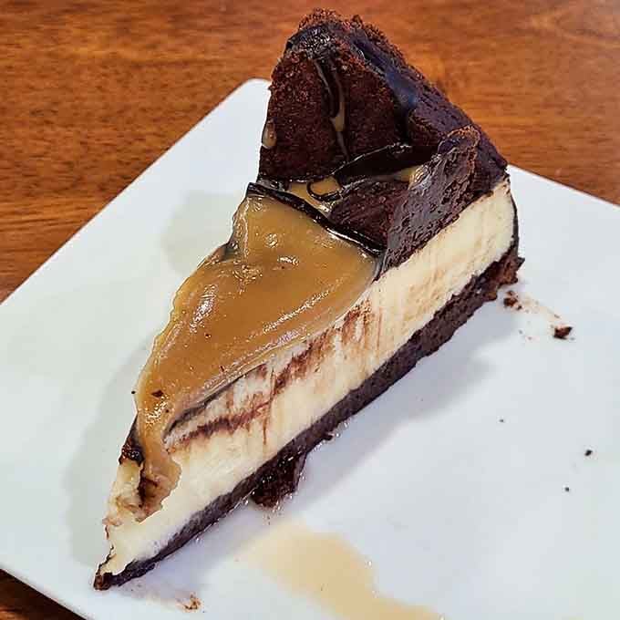 Chocolate cheesecake with caramel drizzle that makes you reconsider every diet decision you've ever made in your entire life.