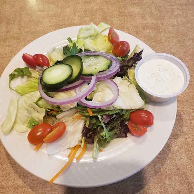 Even the salads here look like they're trying to make you happy, fresh and colorful without any judgment about your burger order.